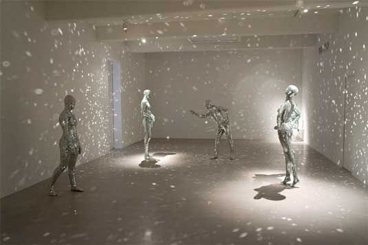 Magical mirror people shed light on consumerism | Creative Bloq