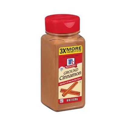 What does blowing cinnamon on your front door do?