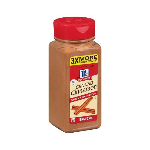 What does blowing cinnamon on your front door do?