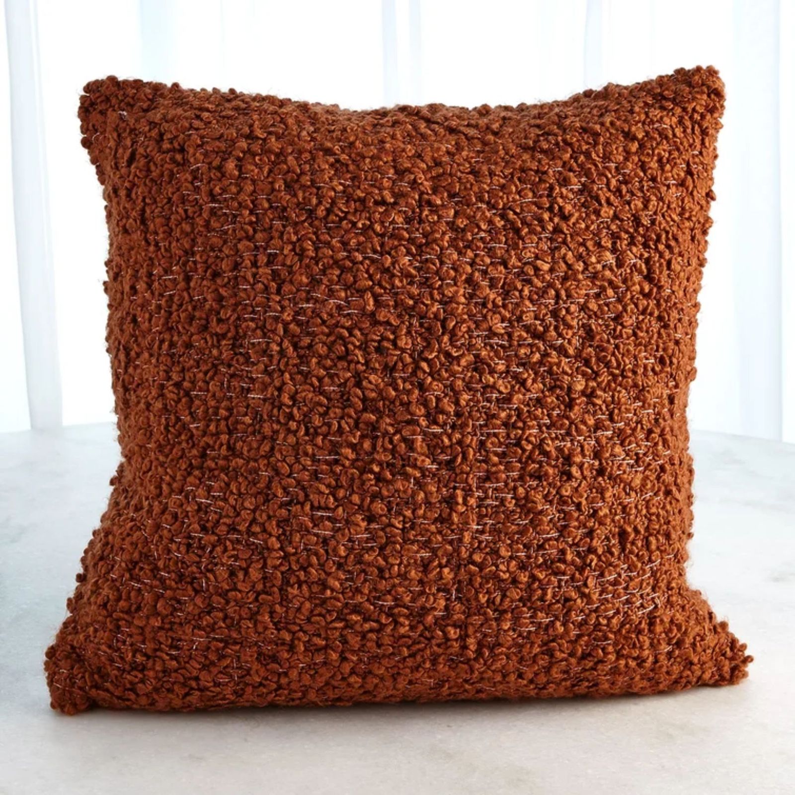 The best bouclé pillows to cozy up to this winter | Homes and Gardens