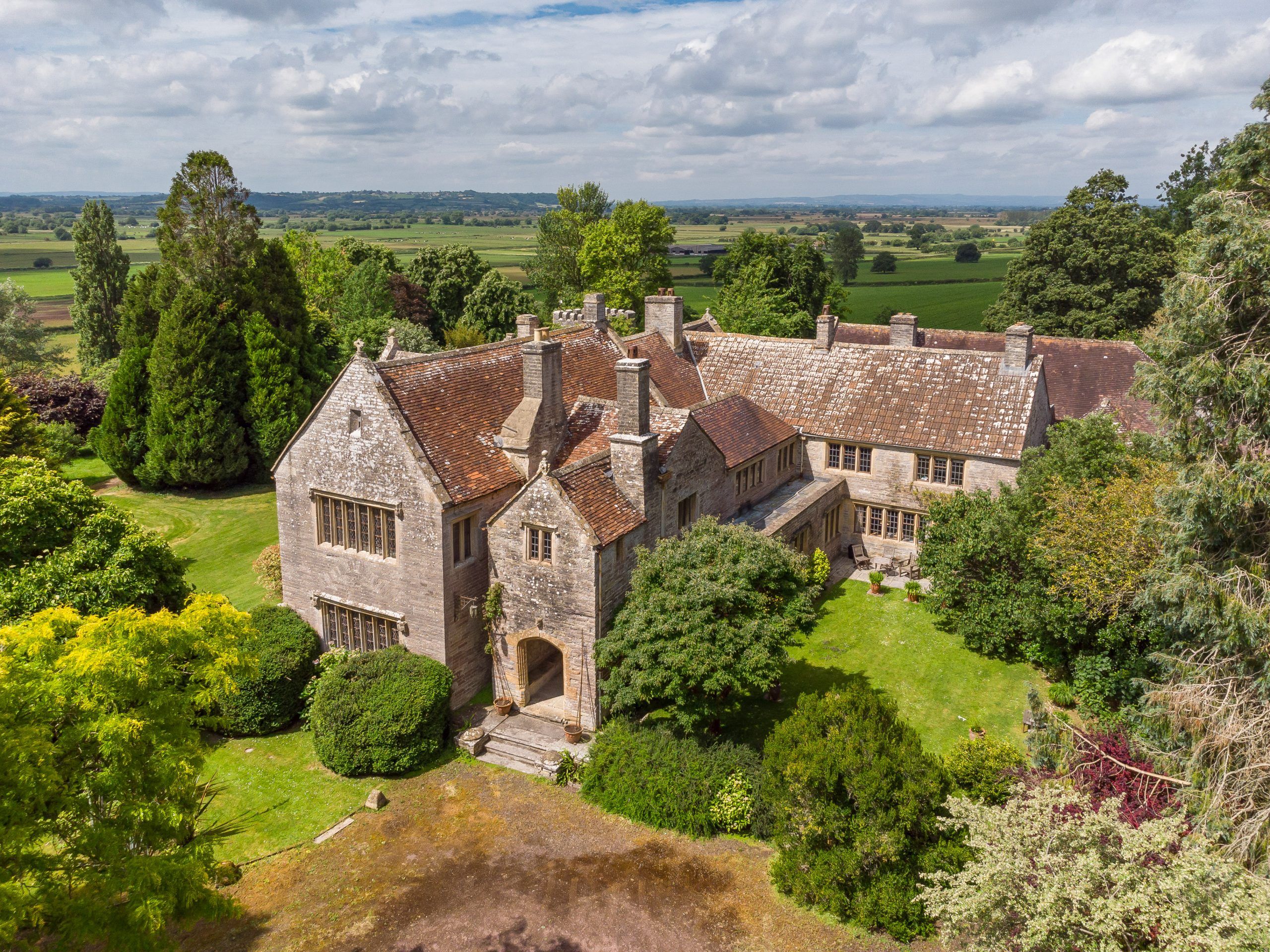A converted medieval monastery set in 16 acres of Somerset that has a ...