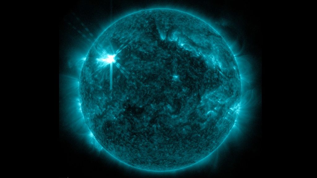 Powerful twin solar flares erupt from sun as cell phone outages spike ...