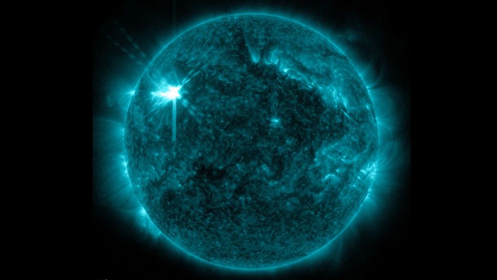Powerful twin solar flares erupt from sun as cell phone outages spike ...