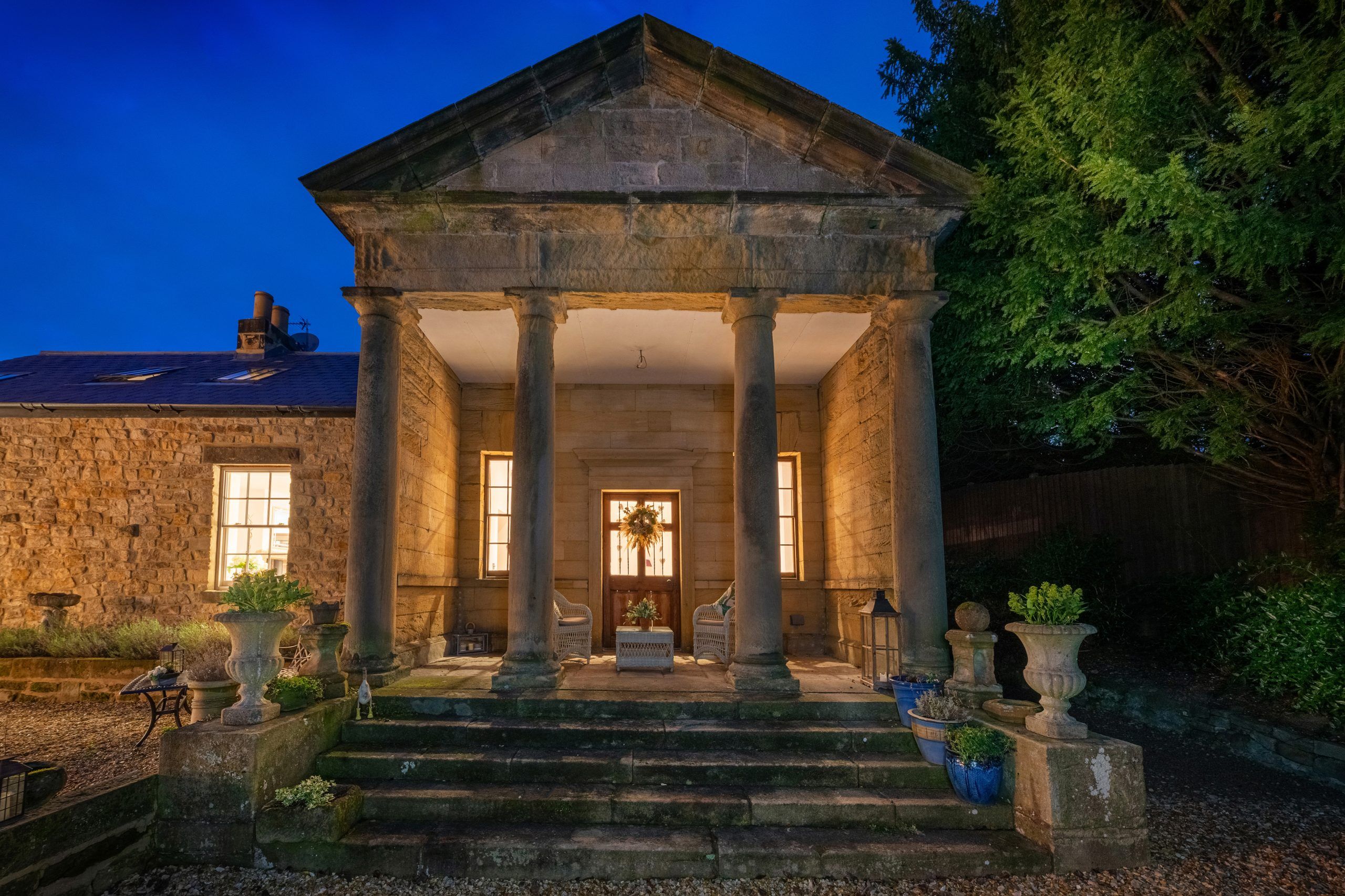 A magnificent former bath house with a classical-style portico and ...
