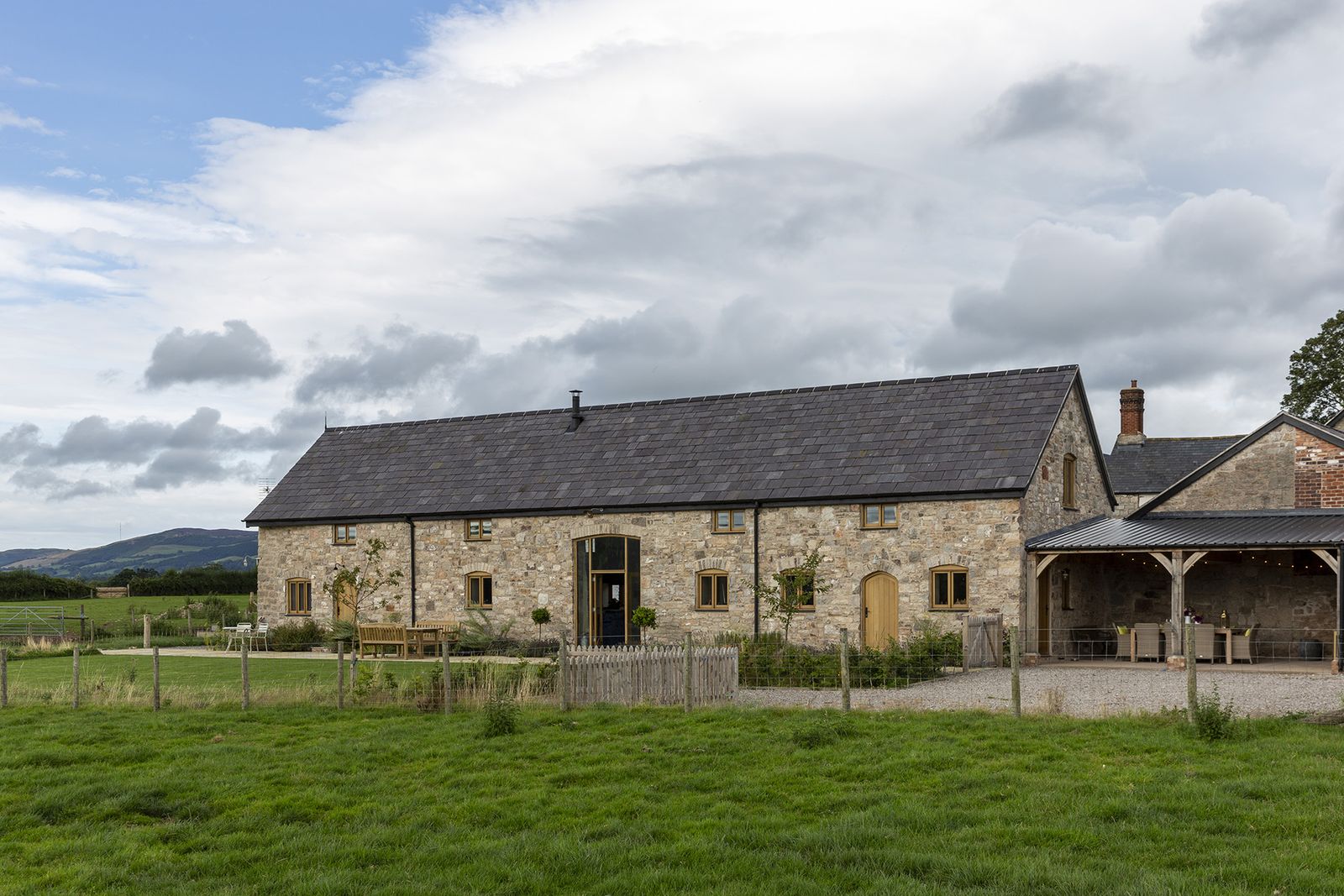 This Welsh barn was rebuilt stone by stone and is now at one with its ...
