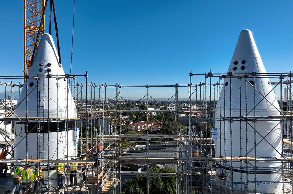 Solid rocket boosters for shuttle Endeavour exhibit capped with nose ...