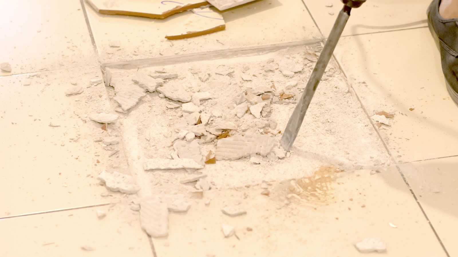 How to replace a broken floor tile without causing damage elsewhere ...