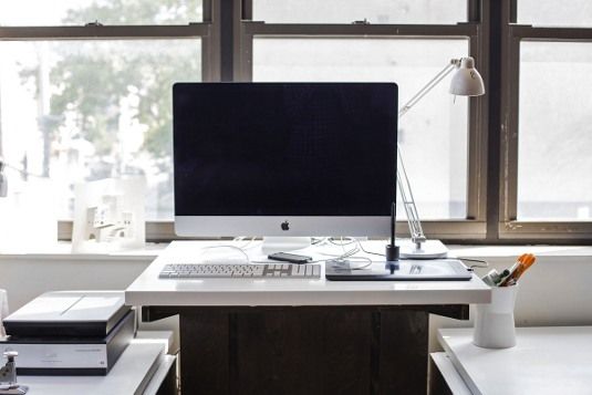 This inspiring workspace features an amazing transforming desk ...