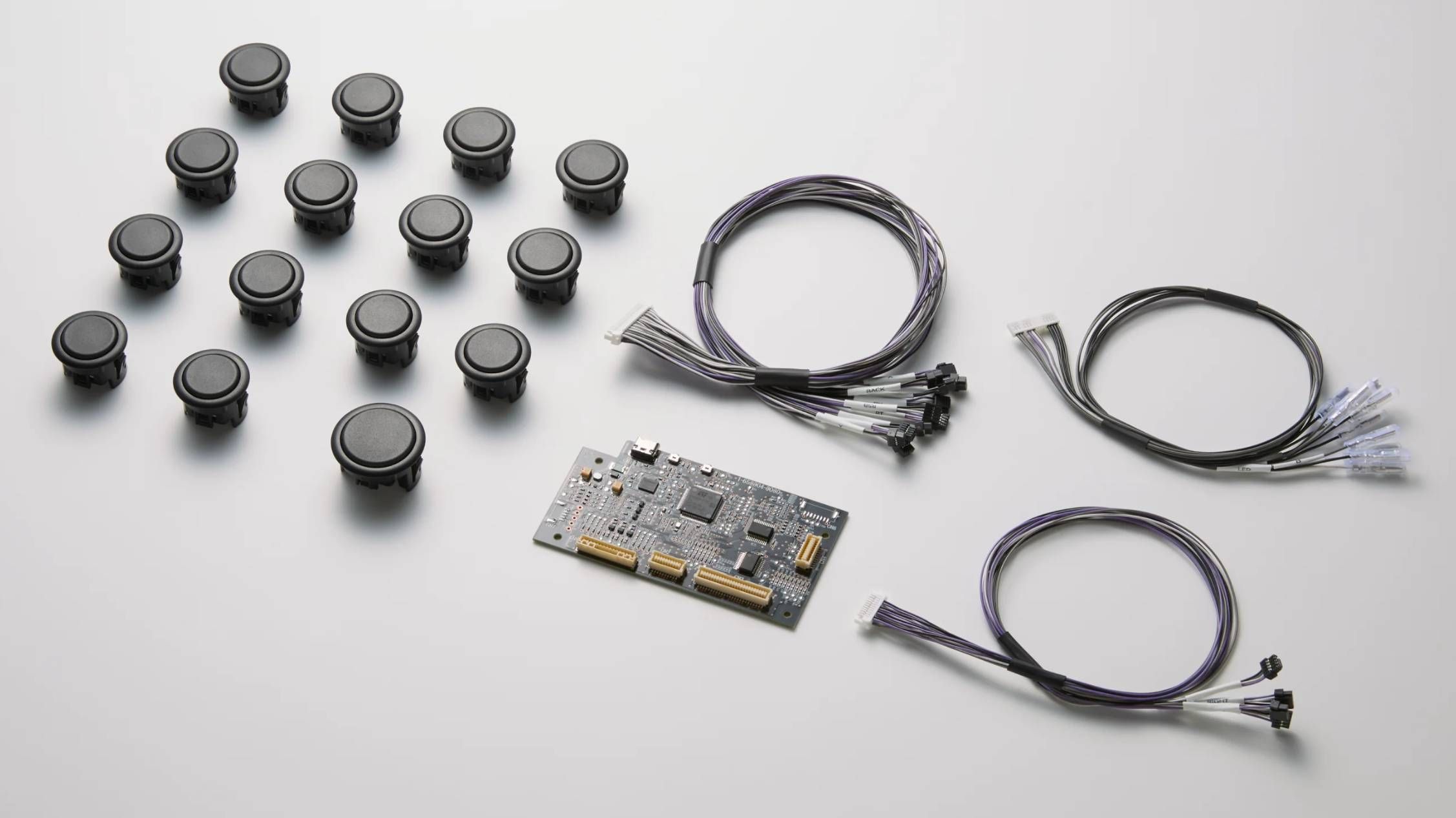 This spicy leverless DIY kit has tiny circuit boards under each button ...