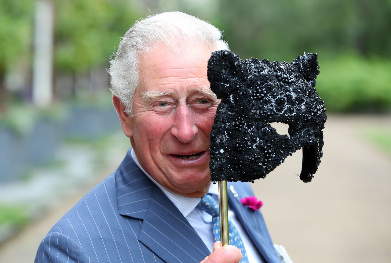 Prince Charles and Camilla in fits of giggles at fancy dress charity ...