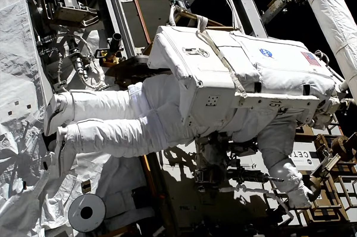 Spacewalking astronauts install array mount outside space station | Space
