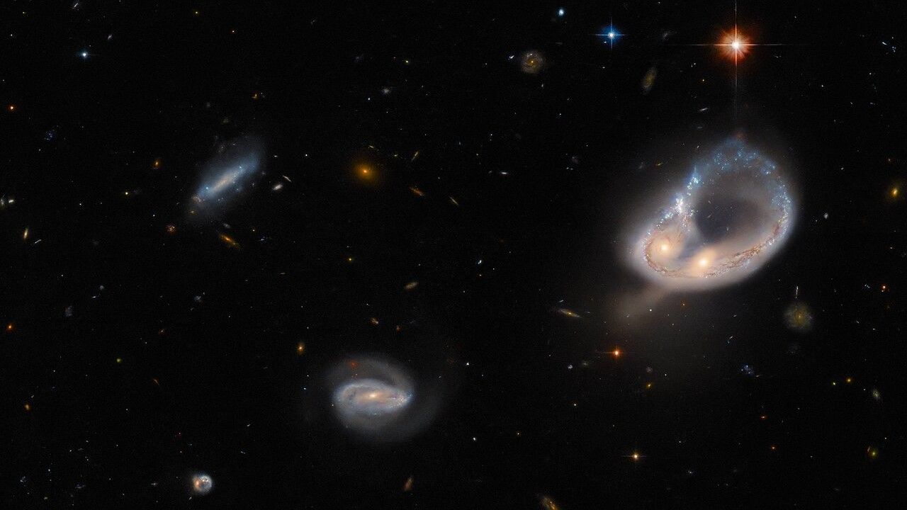 Hubble telescope captures dazzling embrace of merging galaxies | Space