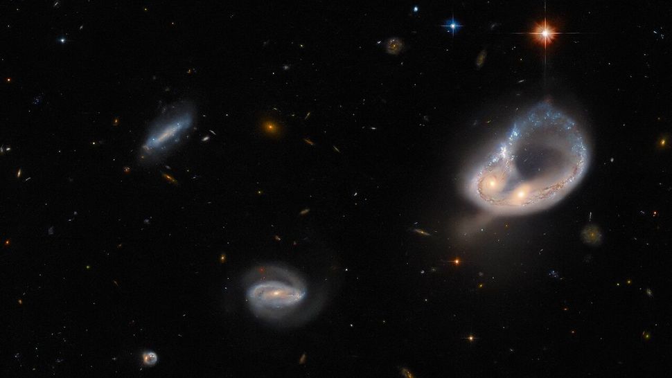 Hubble telescope captures dazzling embrace of merging galaxies | Space