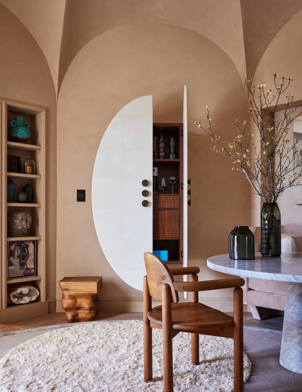 Terracotta lime wash and an umbrella vaulted ceiling in a monochromatic ...