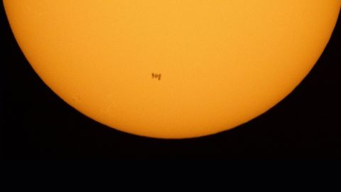 Wow! NASA photographer spots space station crossing the sun during ...
