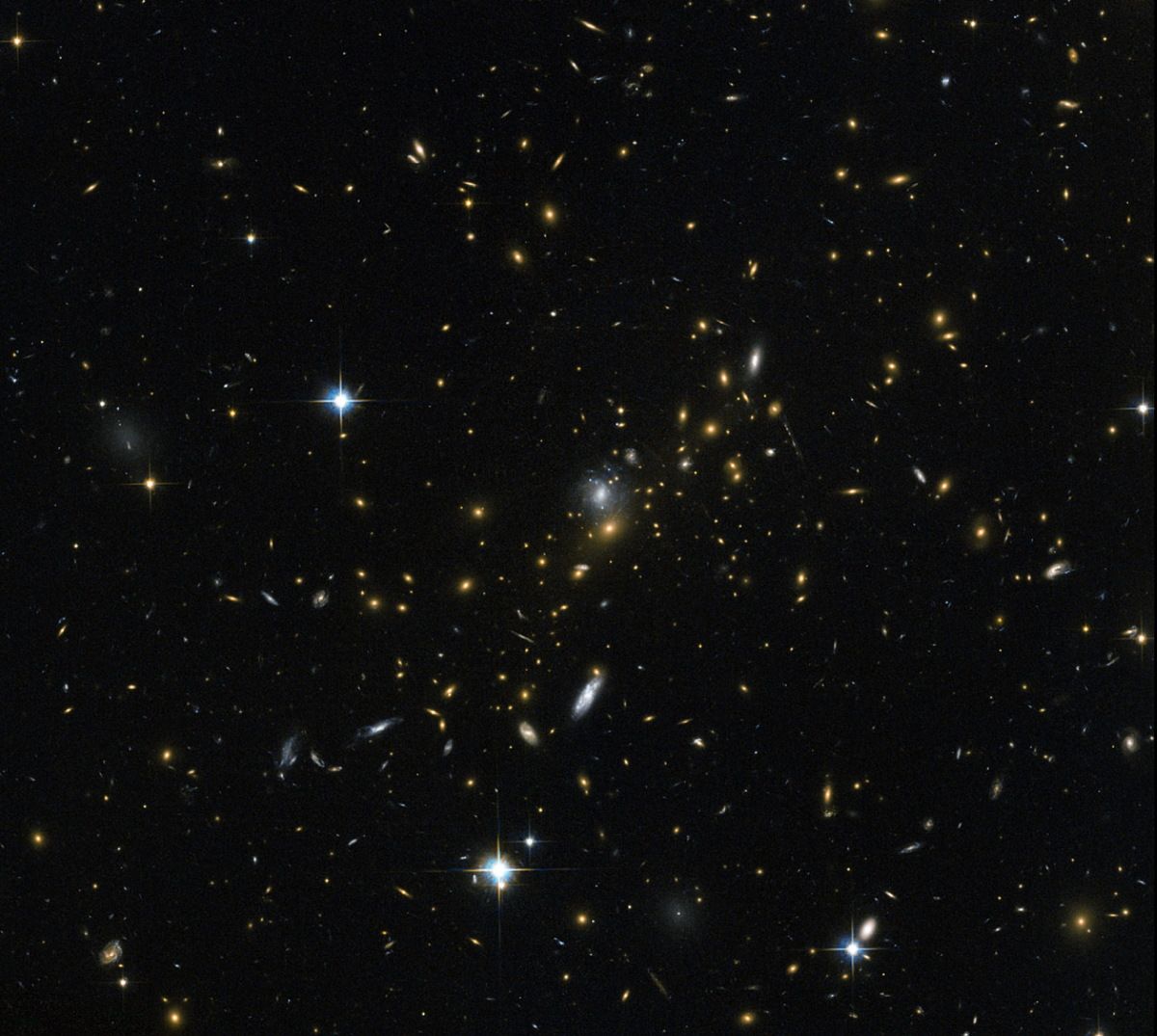 Galaxy Cluster Doubles as Cosmic Magnifying Glass for Hubble Telescope ...