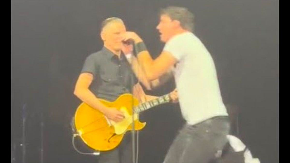 Here’s the moment when a stage-invading fan grabbed Bryan Adams ...