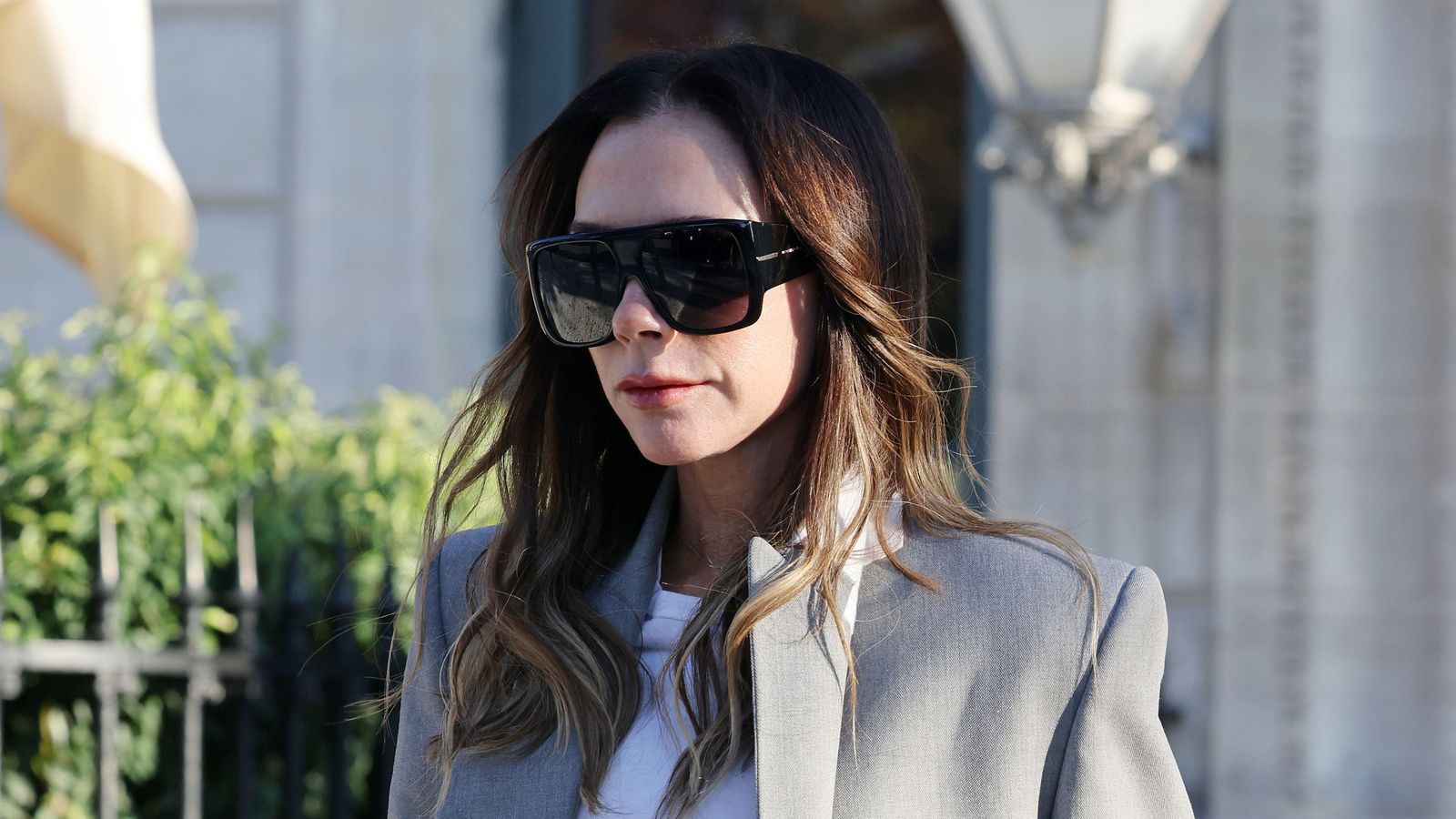 Victoria Beckham perfects Parisian power dressing in a grey suit ...