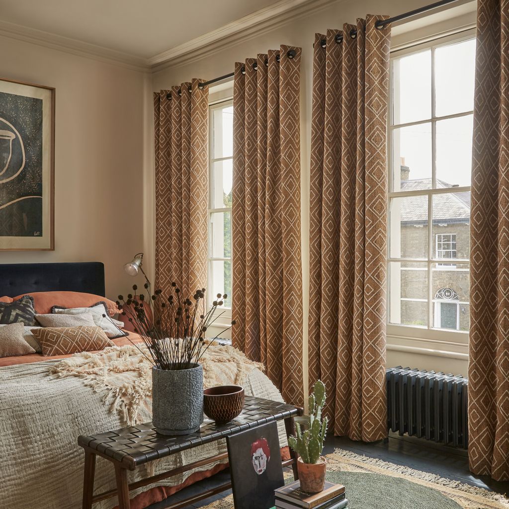 Should bedroom curtains hang over radiators? | Ideal Home