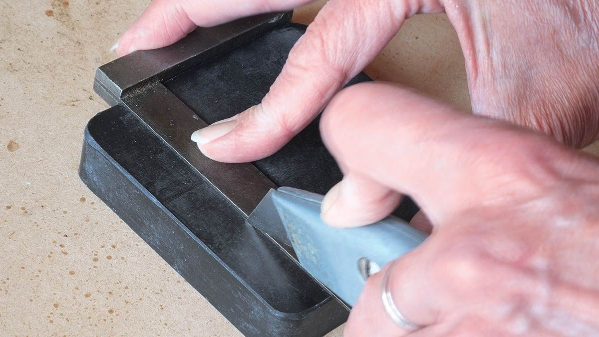 How to install a rubber bridge on an electric guitar | Guitar World