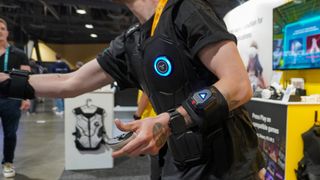 I tested the most advanced haptic VR vest and gloves — it made petting ...