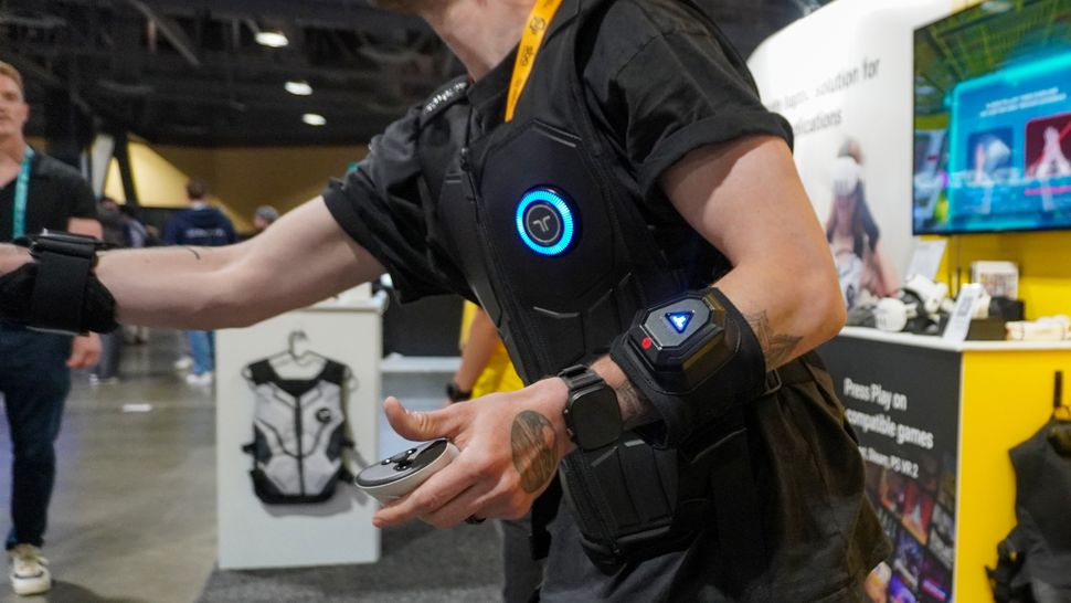 I tested the most advanced haptic VR vest and gloves — it made petting ...