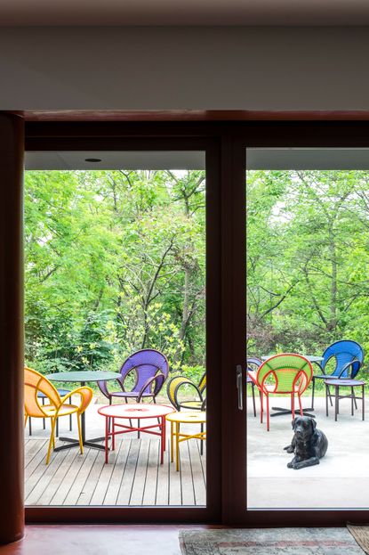 Explore this cabin-style house in Italy with colourful global ...