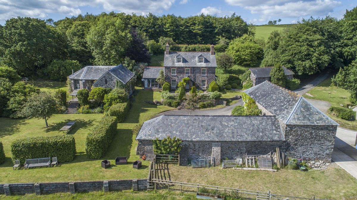 An immaculate Devon farmstead up for sale, with a courtyard, stables ...