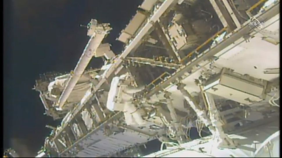 Spacewalking Astronauts Battle Stuck Panel, Wrangle Cables on Space ...
