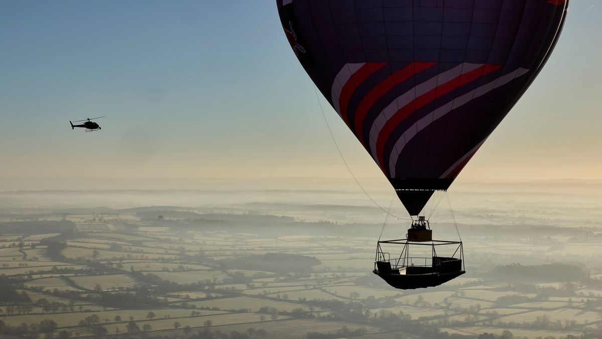 Watch Kriss Kyle riding a BMX bowl suspended under a hot air balloon in ...