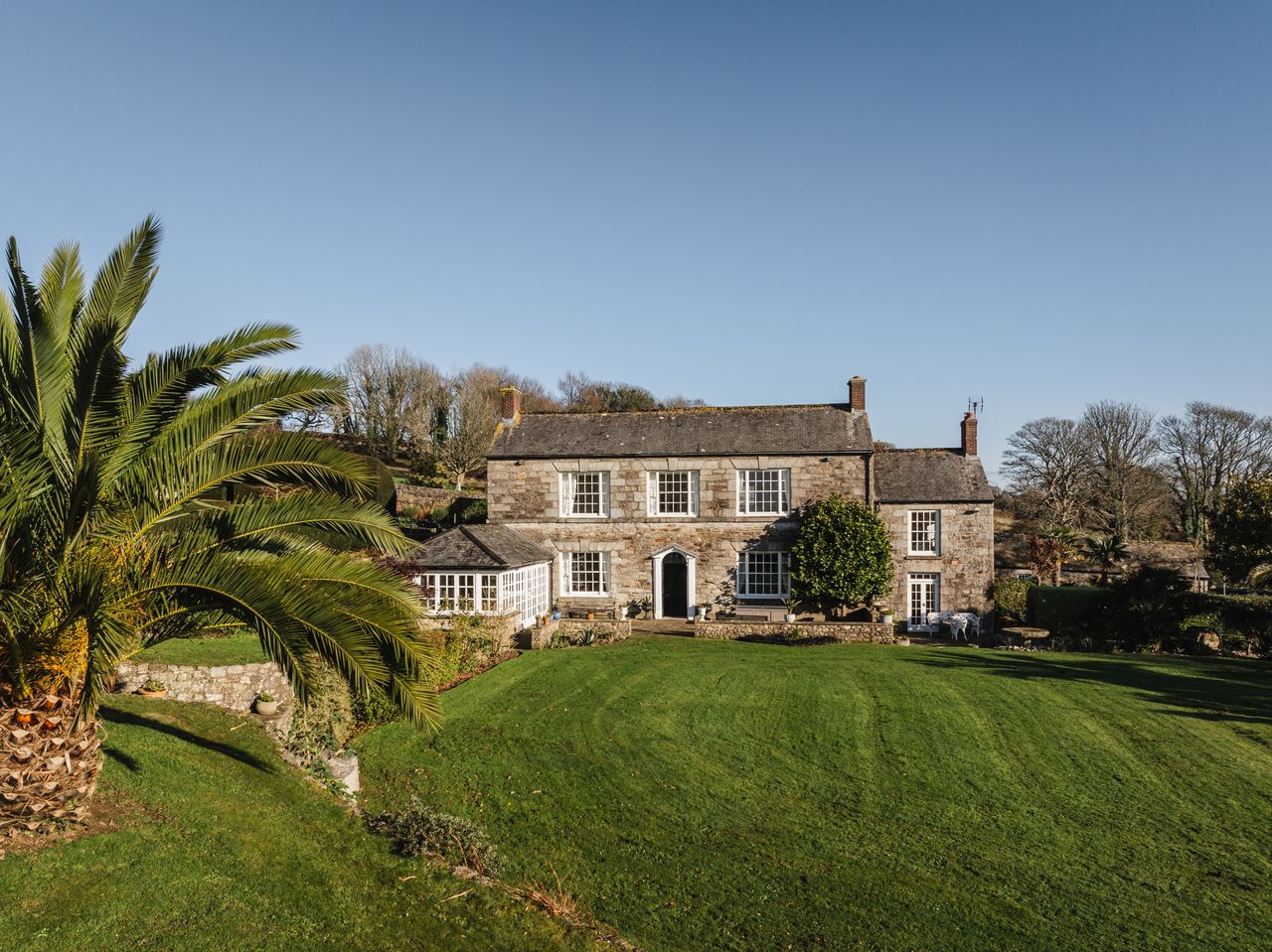 Exotic gardens that delight and surround a Grade II-listed manor for ...