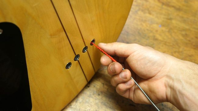 How to restring a bass guitar: guidance from a professional guitar ...