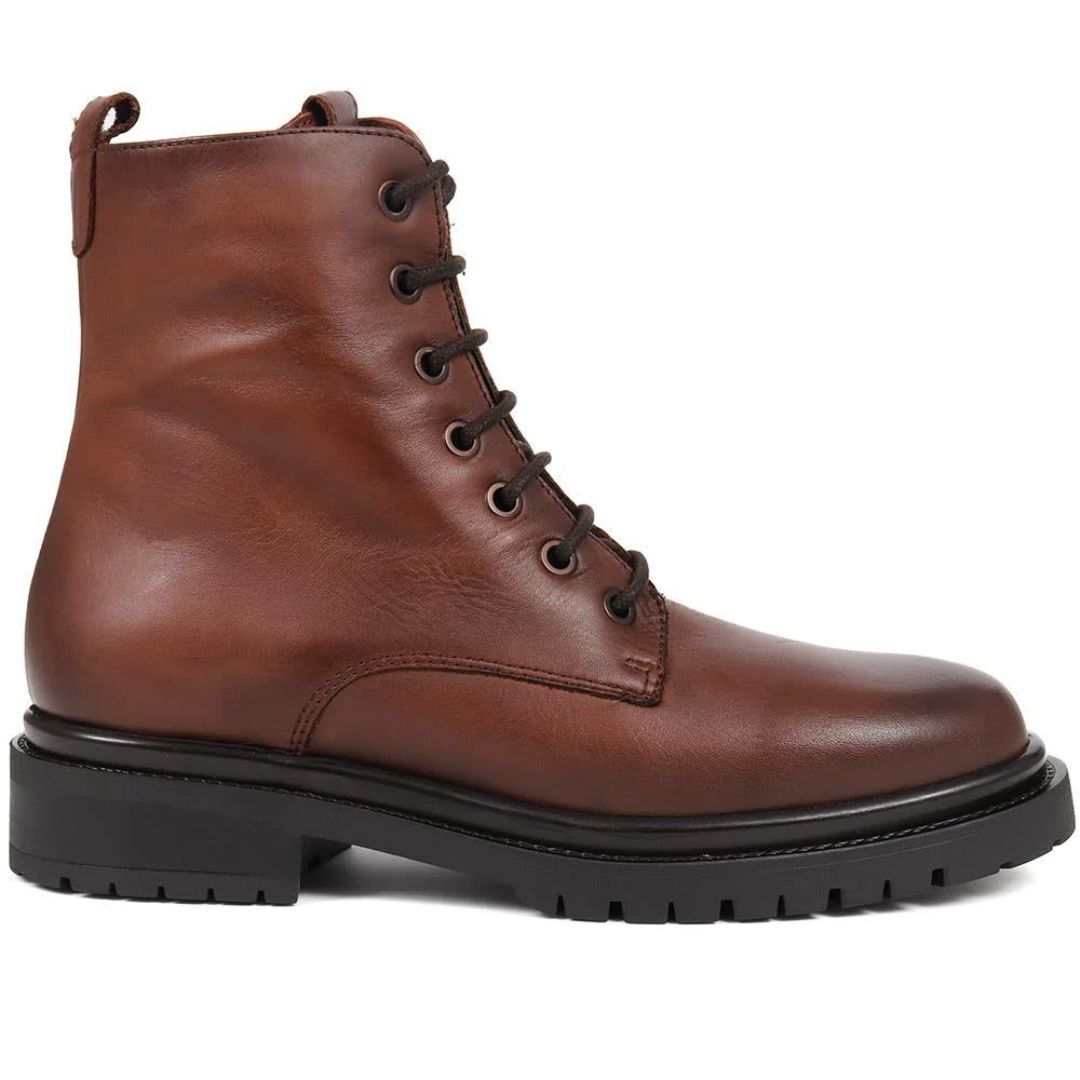 Queen Camilla's old-school boots are smash hit as she nails outdoor ...