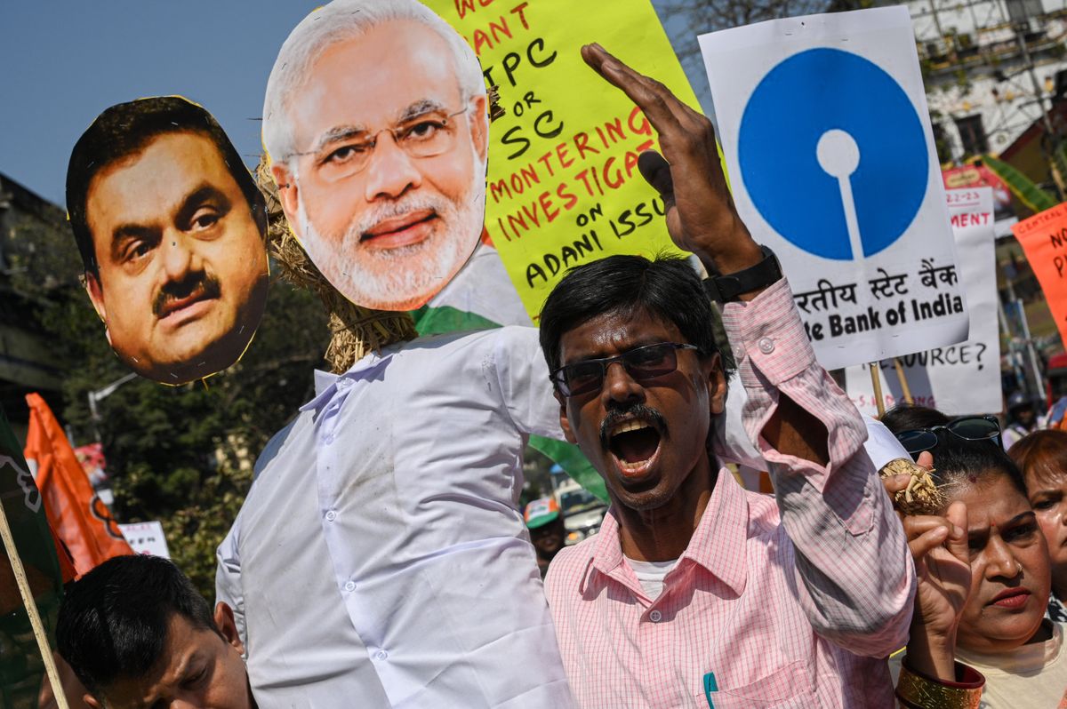 Protesters in India demand official investigation into Adani Group ...