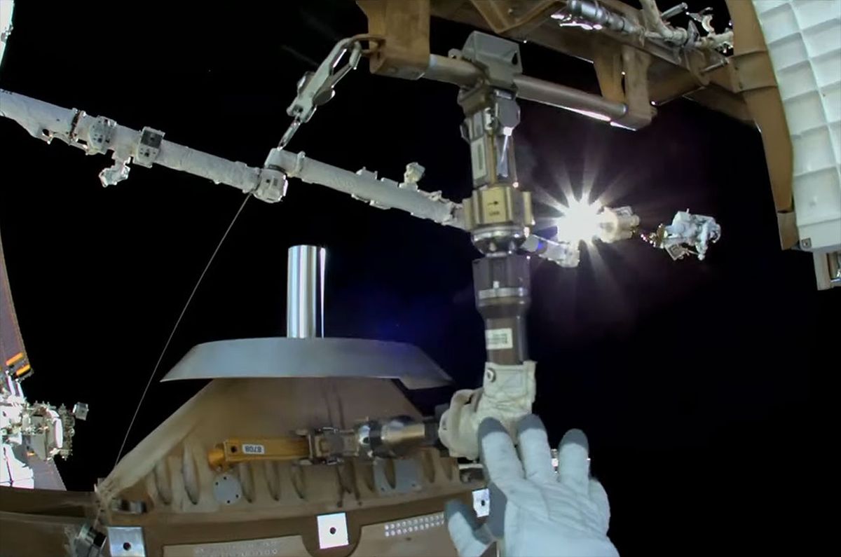 NASA astronauts on spacewalk replace faulty antenna outside space ...