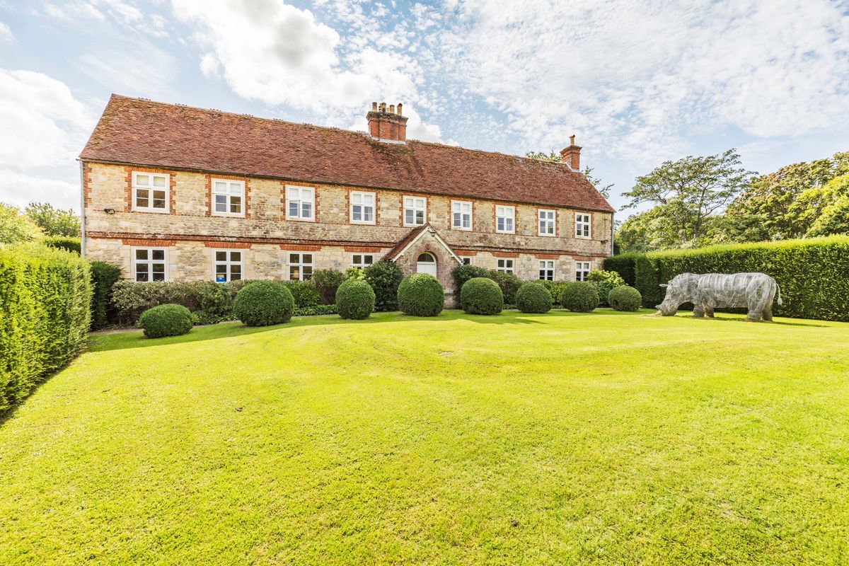 A marvellous, moated manor house complete with giant animal sculptures ...