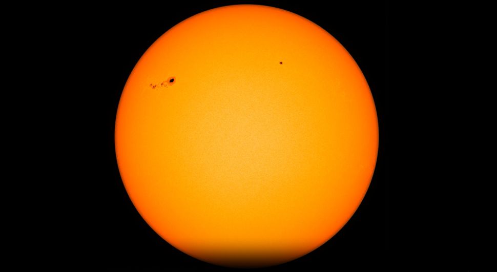 Powerful twin solar flares erupt from sun as cell phone outages spike ...