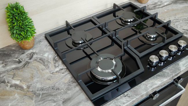 How to clean a gas stove top to make it look spotless | Tom's Guide