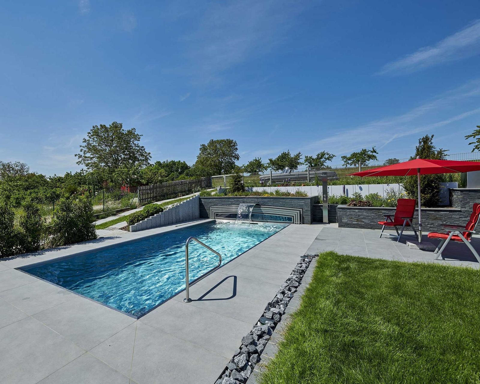 Pool waterfall ideas: 10 looks to elevate your swimming pool | Gardeningetc