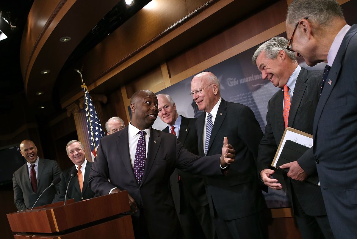 Ebullient bipartisan group of senators unveil plan for more humane ...