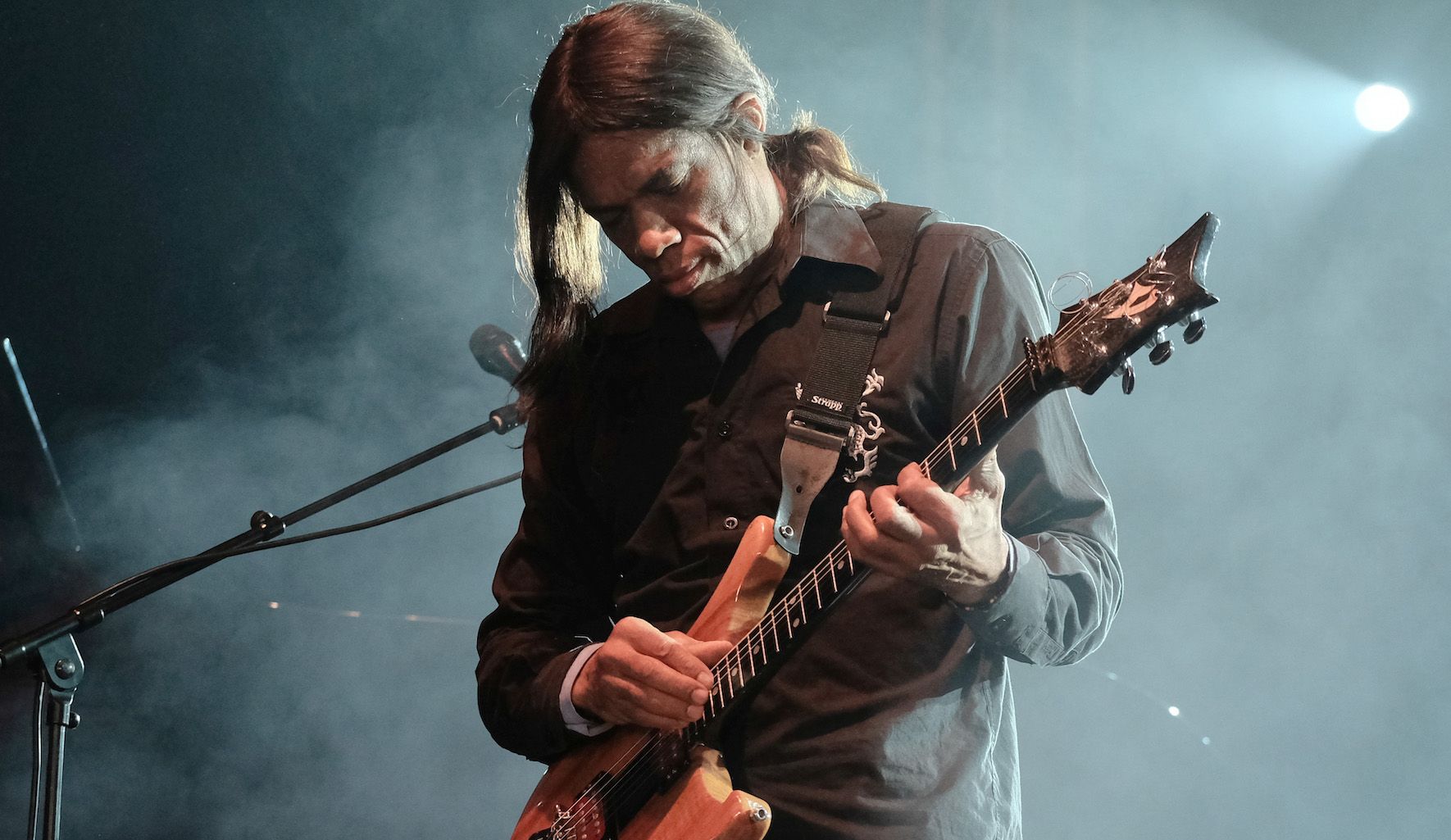 “When I switched to guitar, I still had the piano in me, so I developed ...