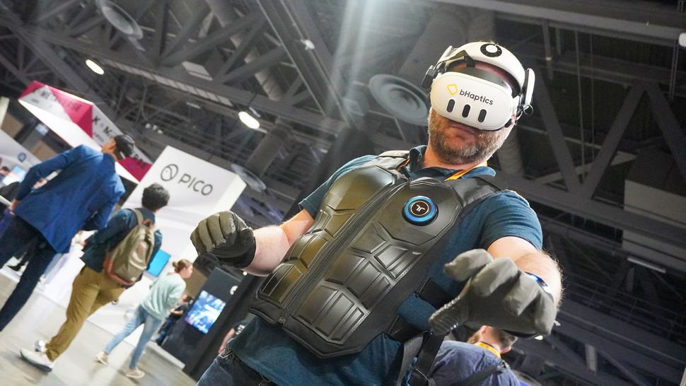 I tested the most advanced haptic VR vest and gloves — it made petting ...