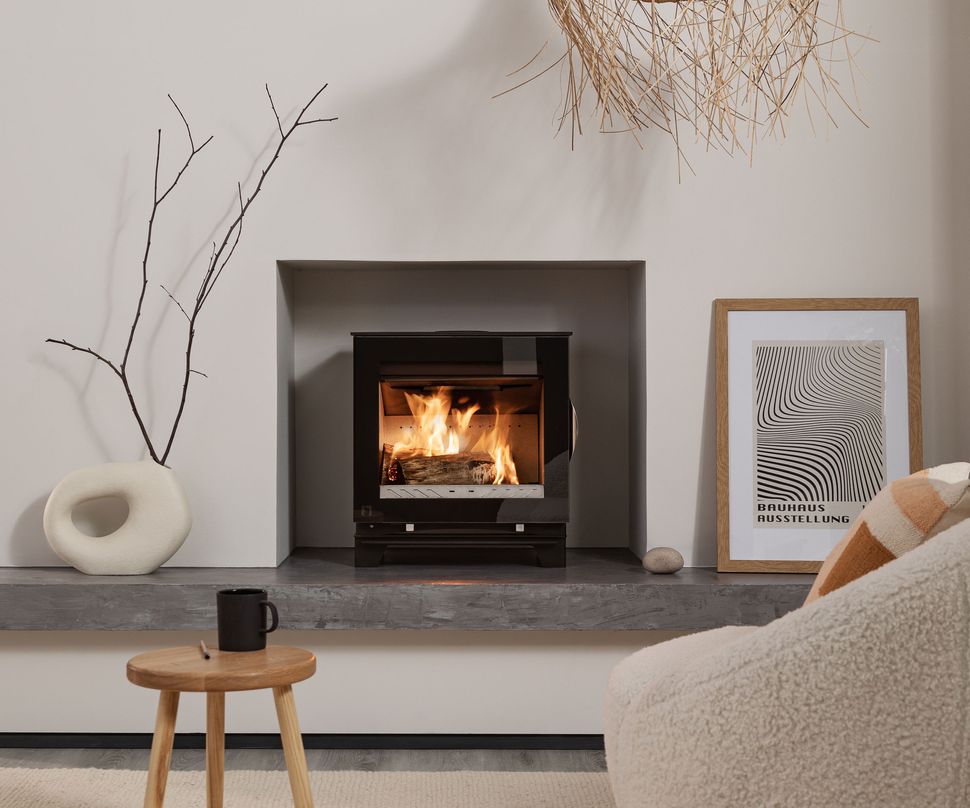 11 log burner surround ideas for every type of stove | Homebuilding