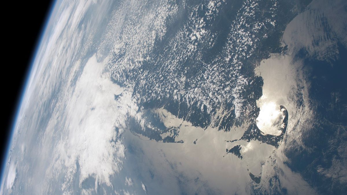 Stunning 'sunglint' turns the sea's surface into a swirling silver ...