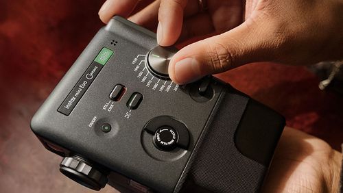 This compact camera looks like a disposable film cam, but the retro ...