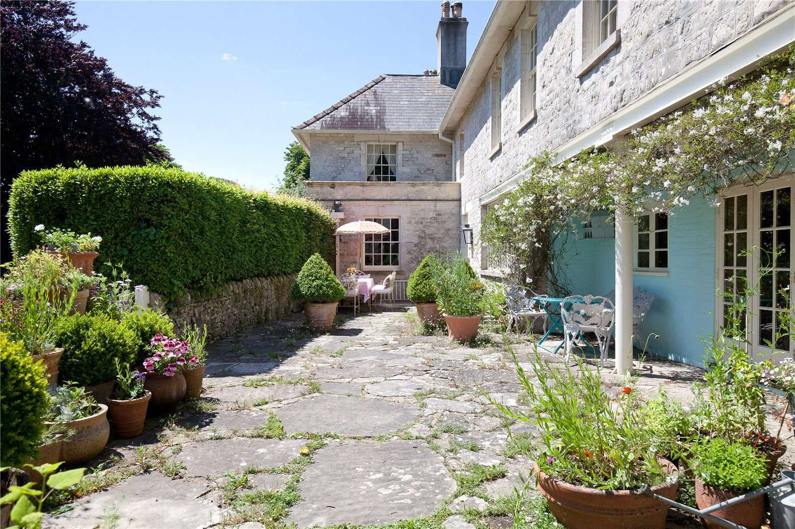 A beautiful family home with wonderful romantic gardens, set in a ...