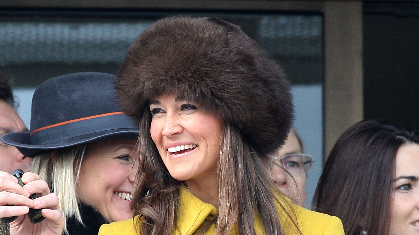 Pippa Middleton paired a canary yellow coat and chocolate brown knee ...
