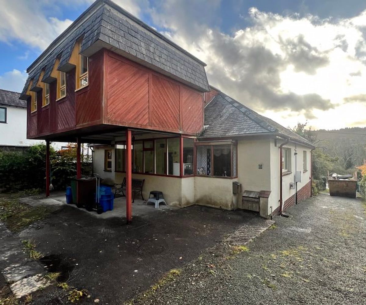 This unusual bungalow has 'mansard loft extension' on stilts | Homebuilding