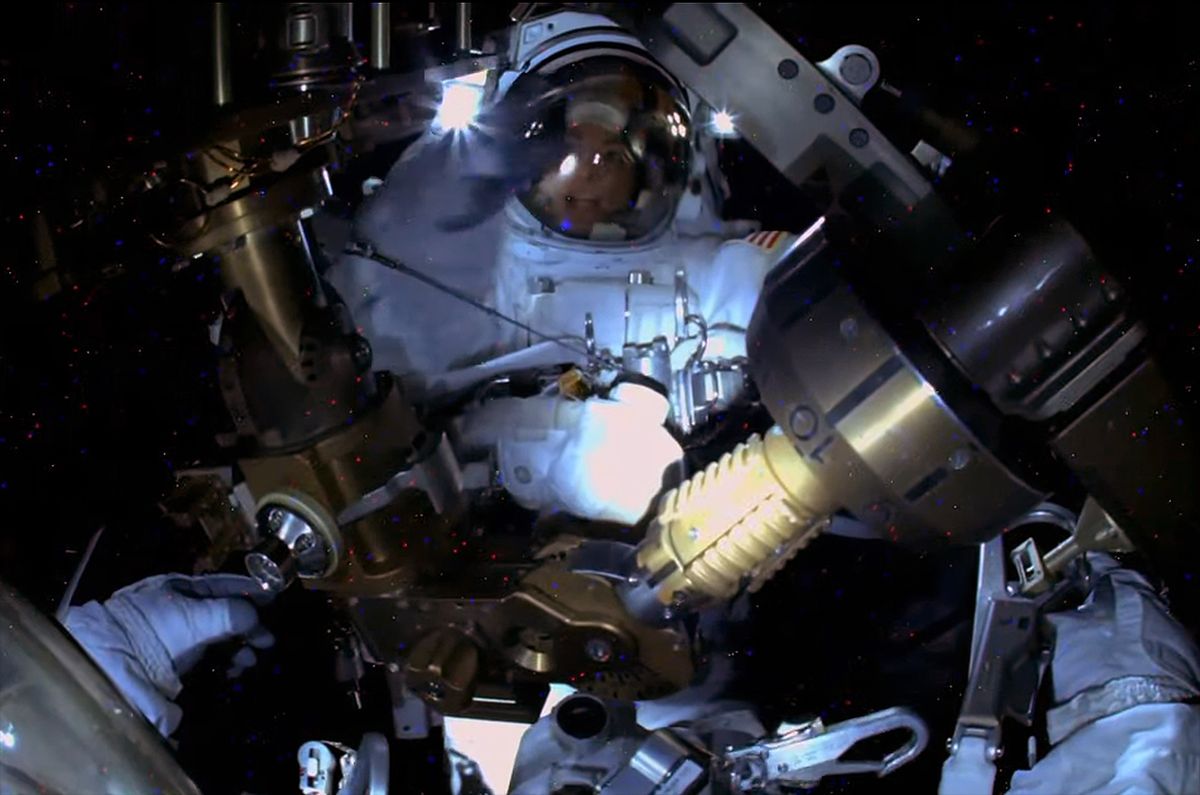 Spacewalking astronauts hit snags installing solar array mount on ISS ...