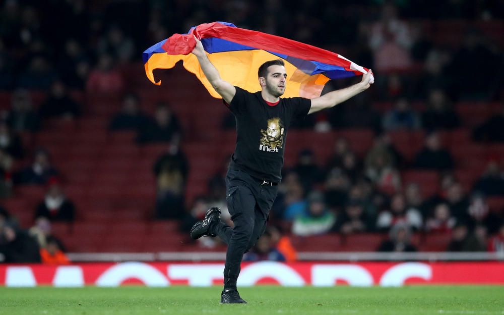 Arsenal fined over pitch invader and late kick-off in Europa League ...